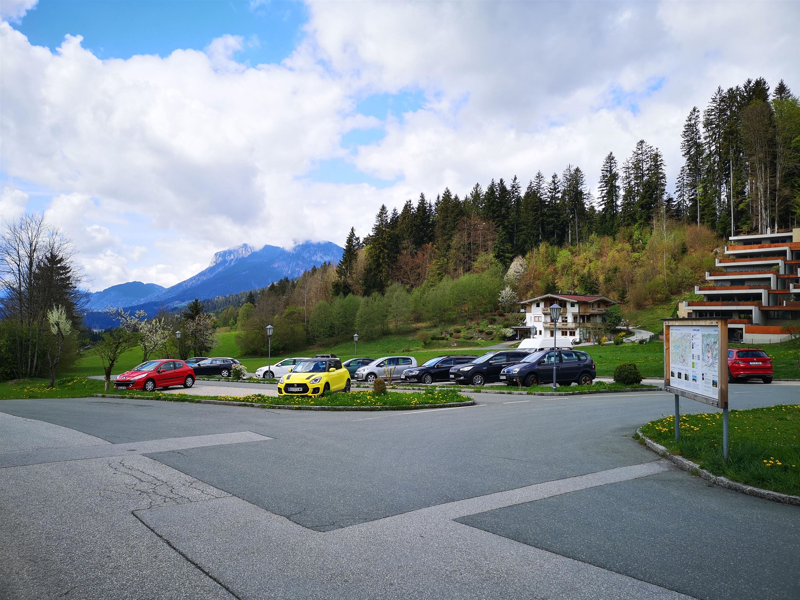 Community hall Scheffau car park with E-charging station in Scheffau
